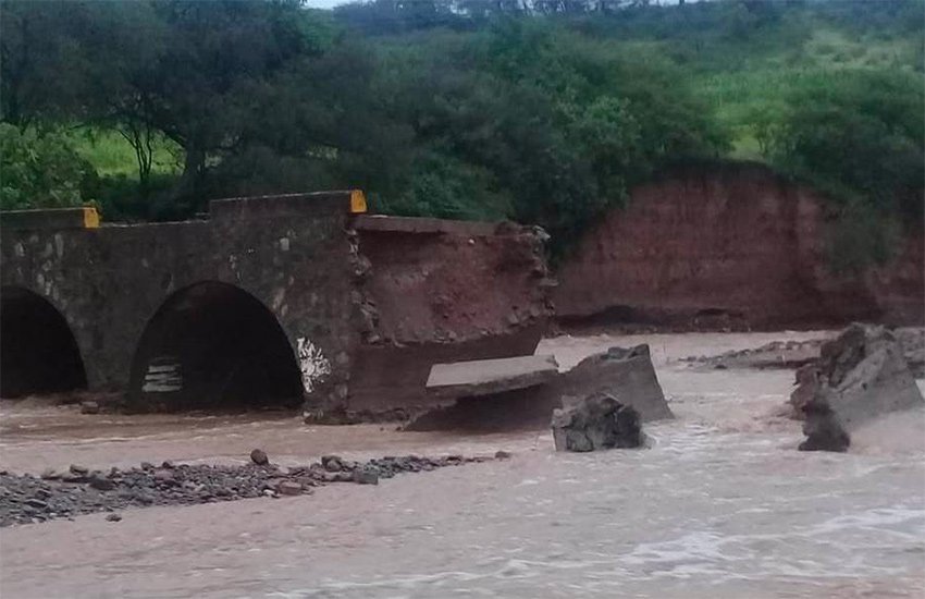 Bridge damaged by heavy rain, cutting off 2,000 people