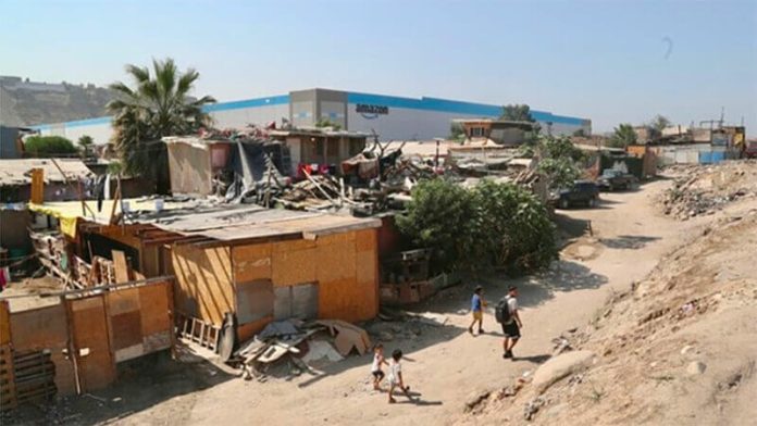 Amazon building in Tijuana sits in sharp contrast to its surroundings