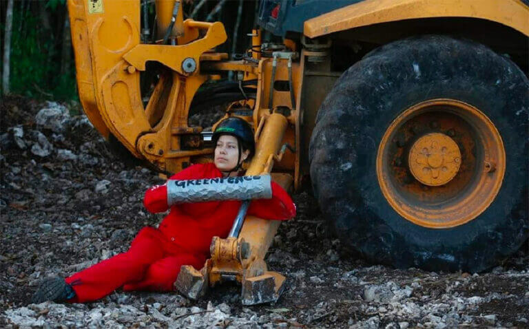 Maya Train protesters tie themselves to machinery to stop work